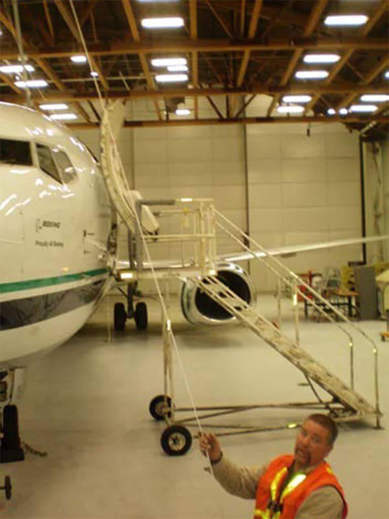 Wood-frame Aircraft Hangar Flexrail Retrofit - Flexible Lifeline Systems